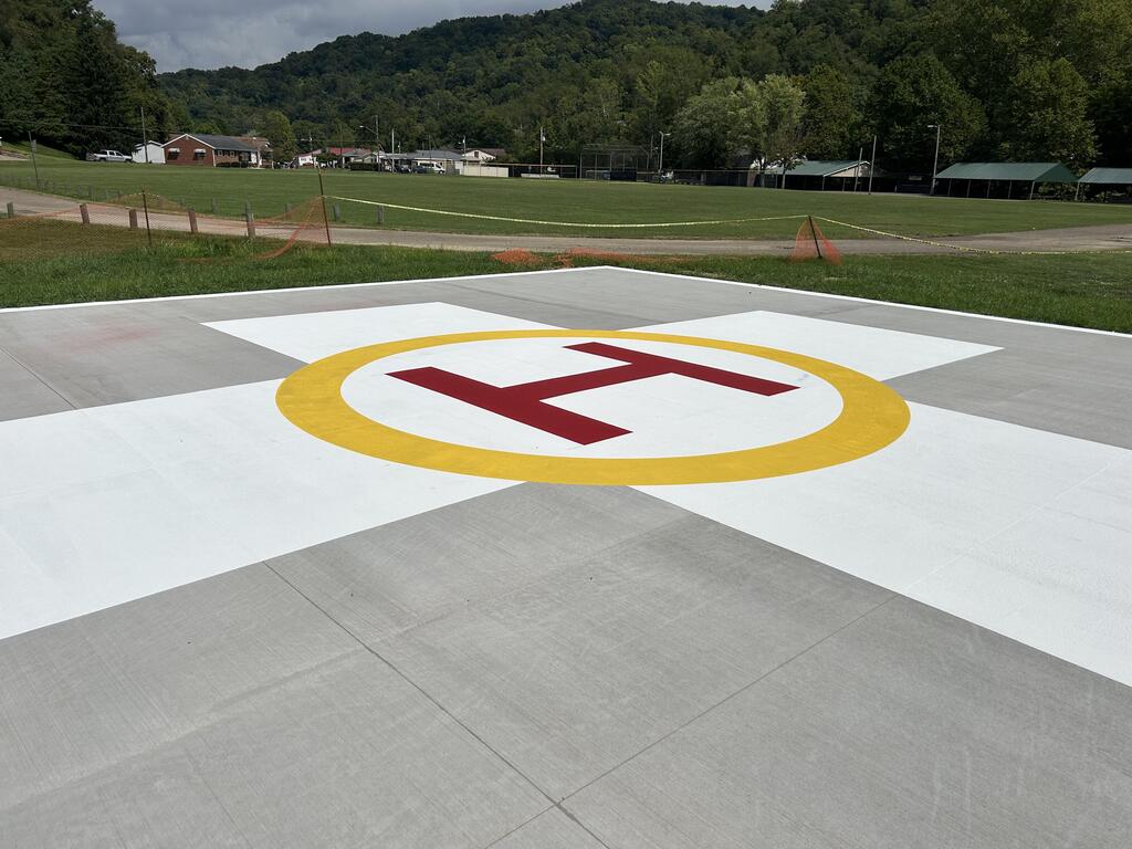 Specific criteria must be met for secure landings on a helipad.